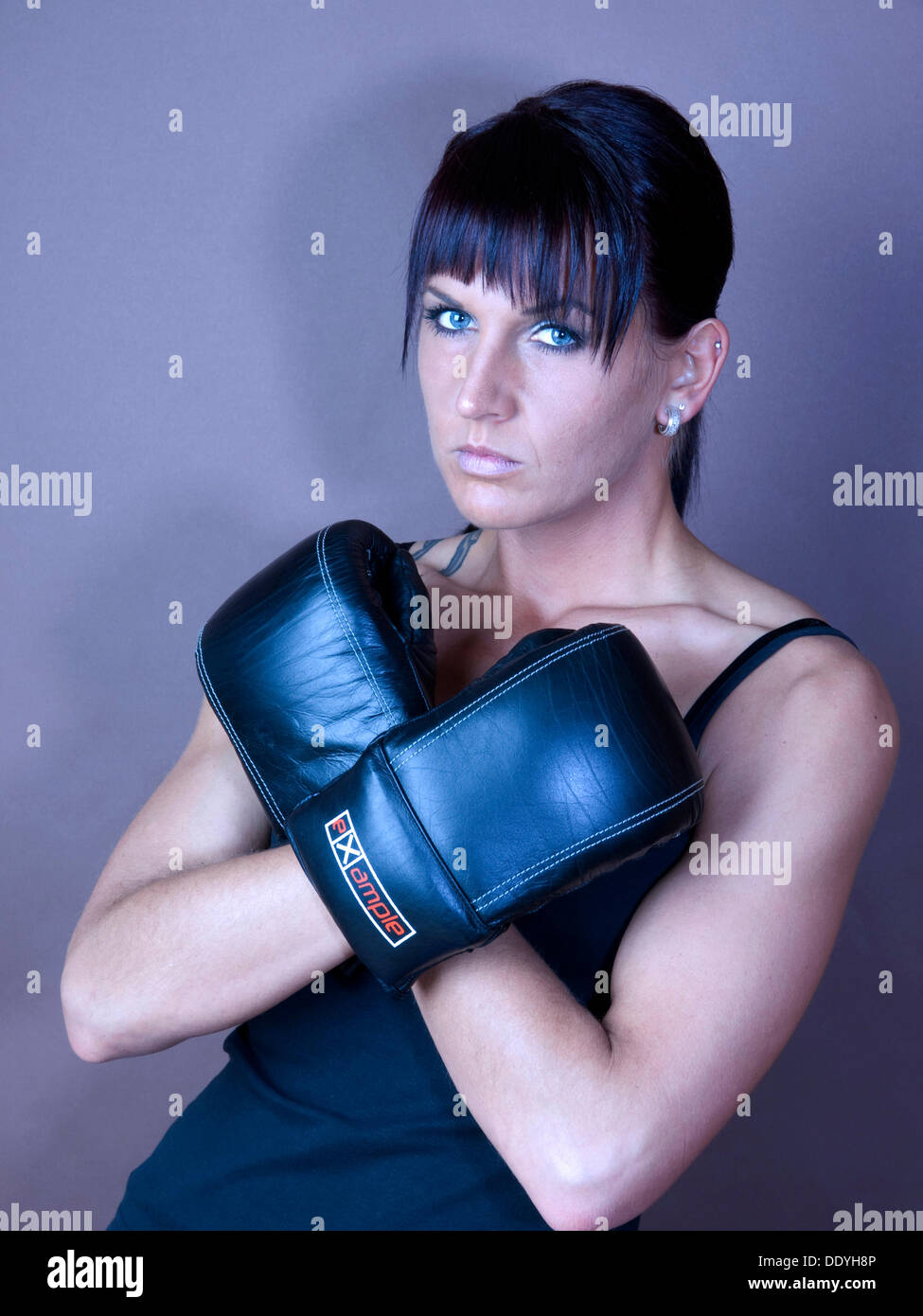 Woman, athlete, boxer, looking serious, standing Stock Photo - Alamy