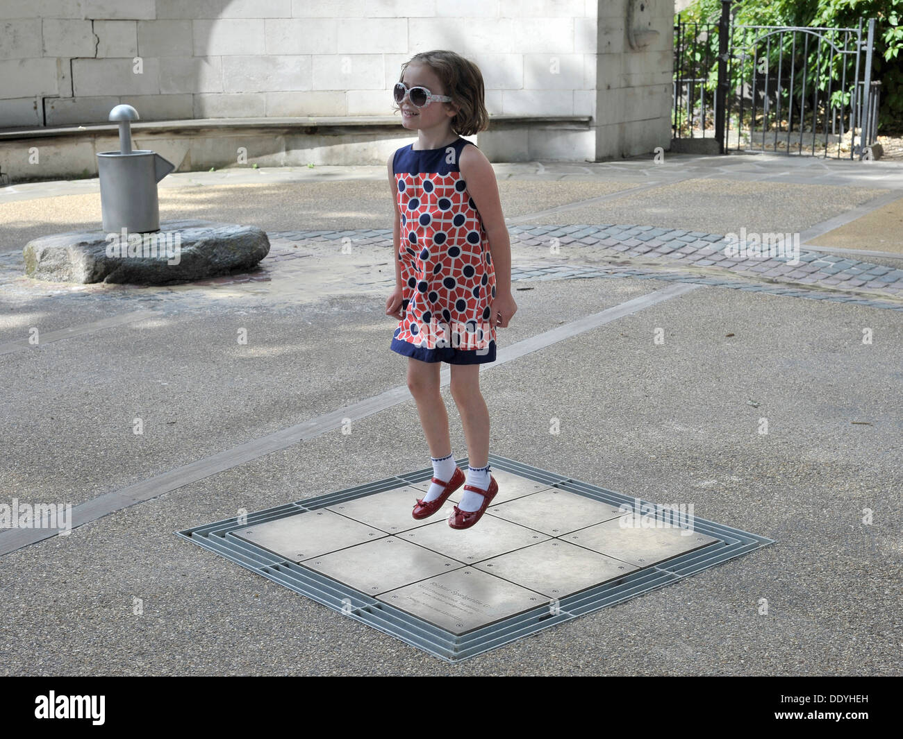 young girl playing chime Stock Photo - Alamy