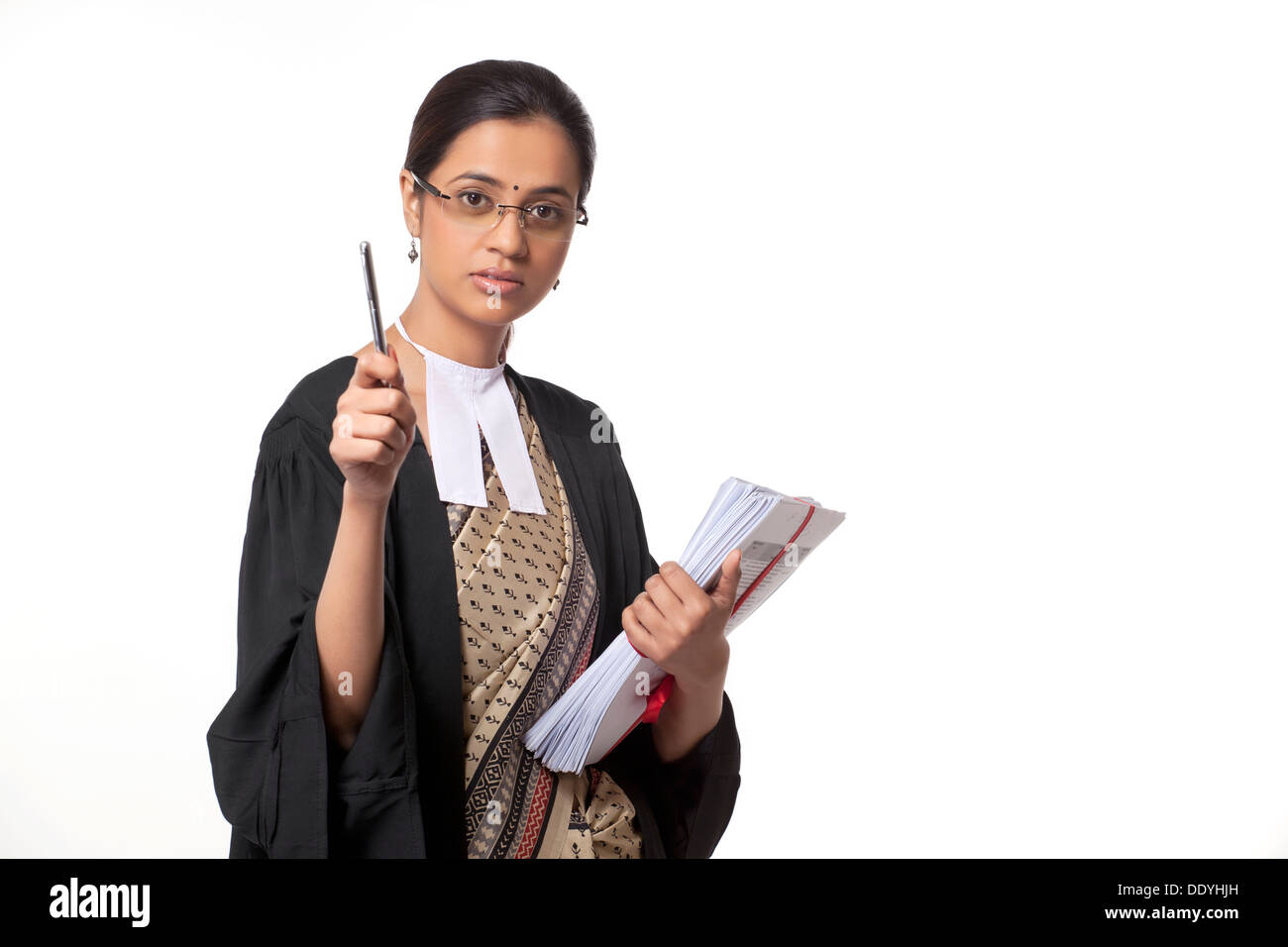 Portrait of young female lawyer holding pen and documents isolated over ...