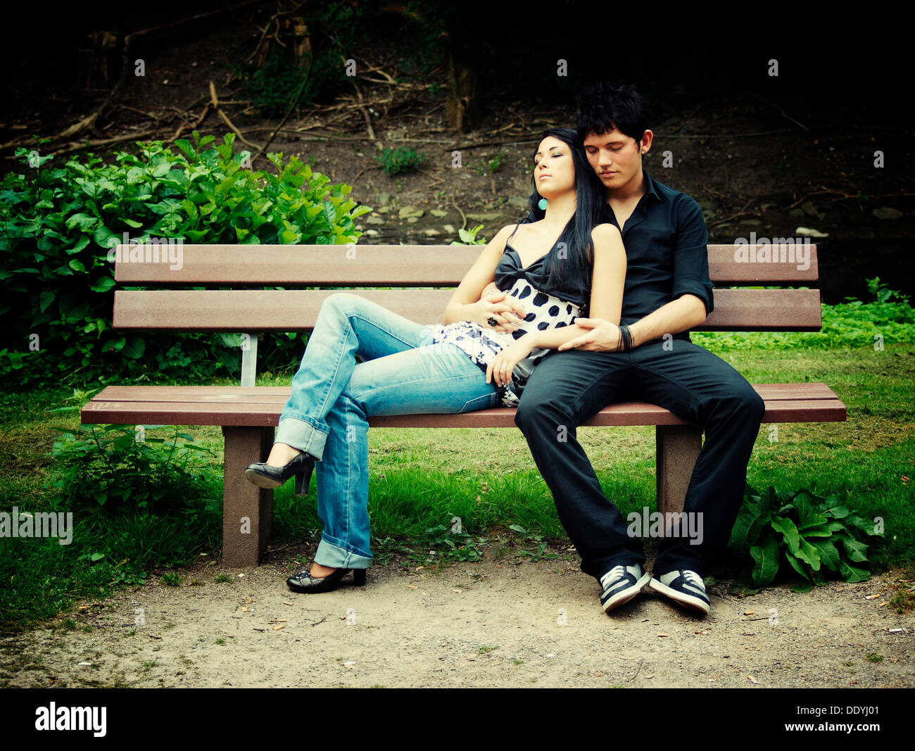 Young couple sleeping on bench hi-res stock photography and images - Alamy