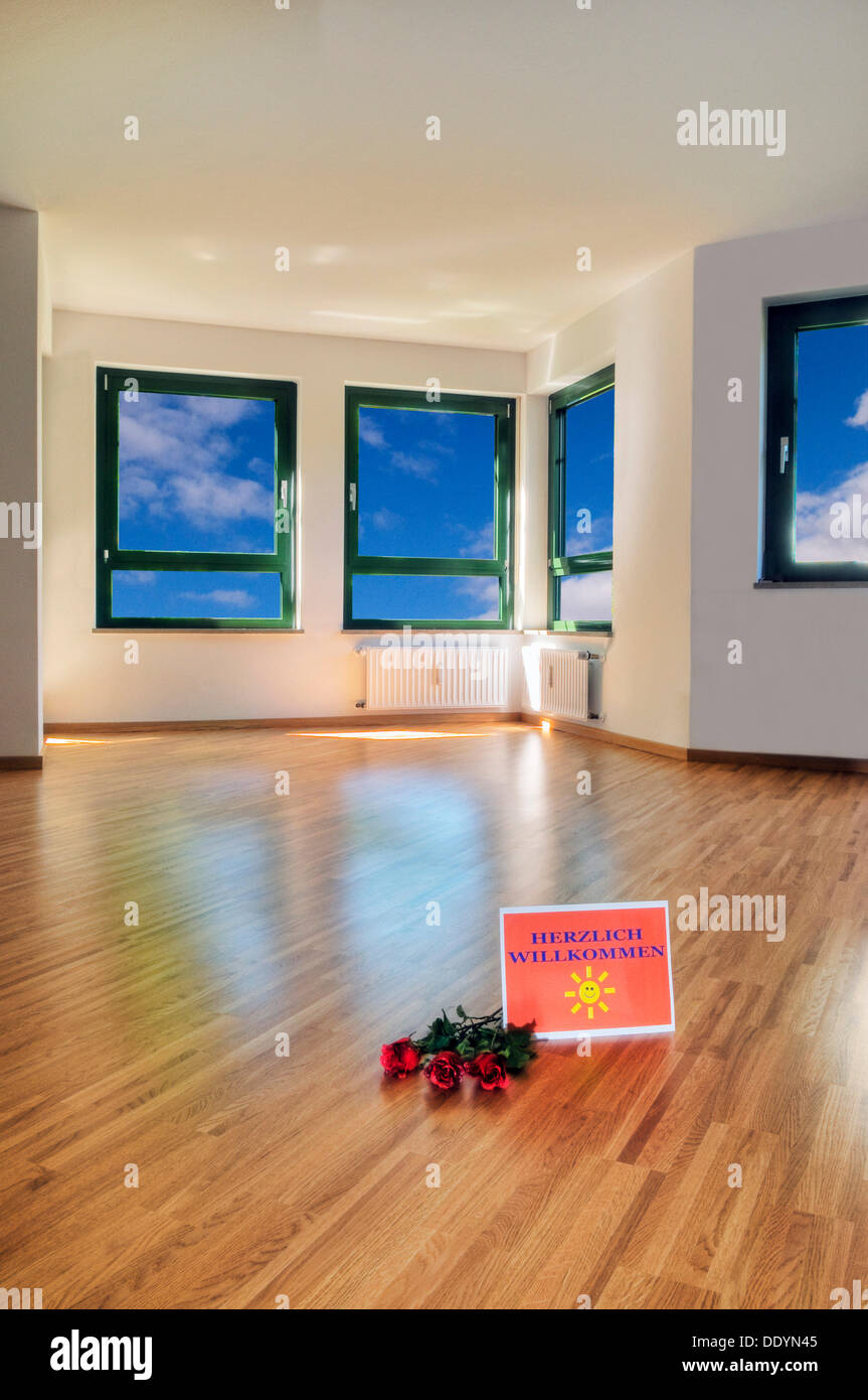 Welcome sign and roses on the floor, large living room with windows and ...