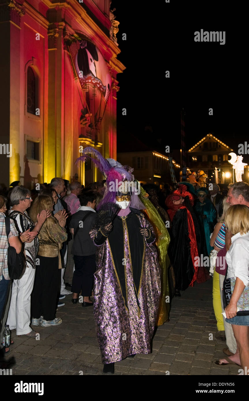 Parade of mask wearers in front of the historic municipal church ...