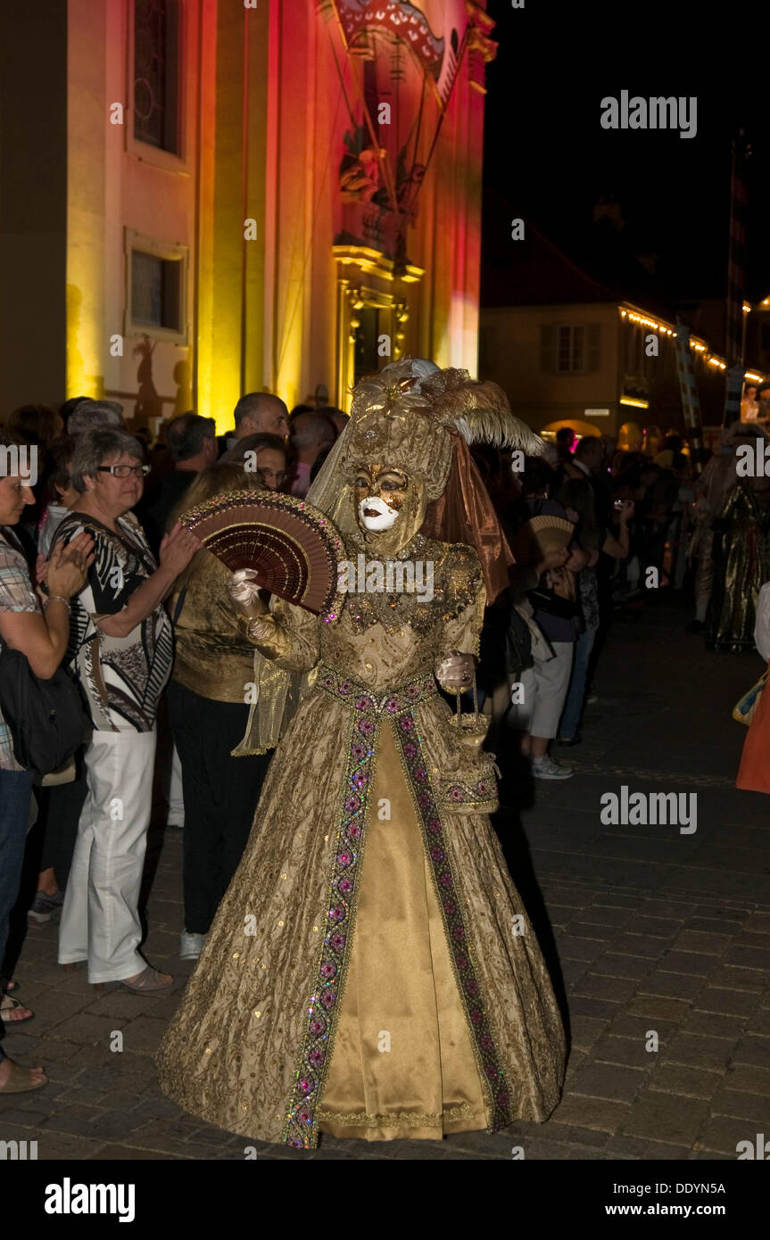 Parade of mask wearers in front of the historic municipal church ...