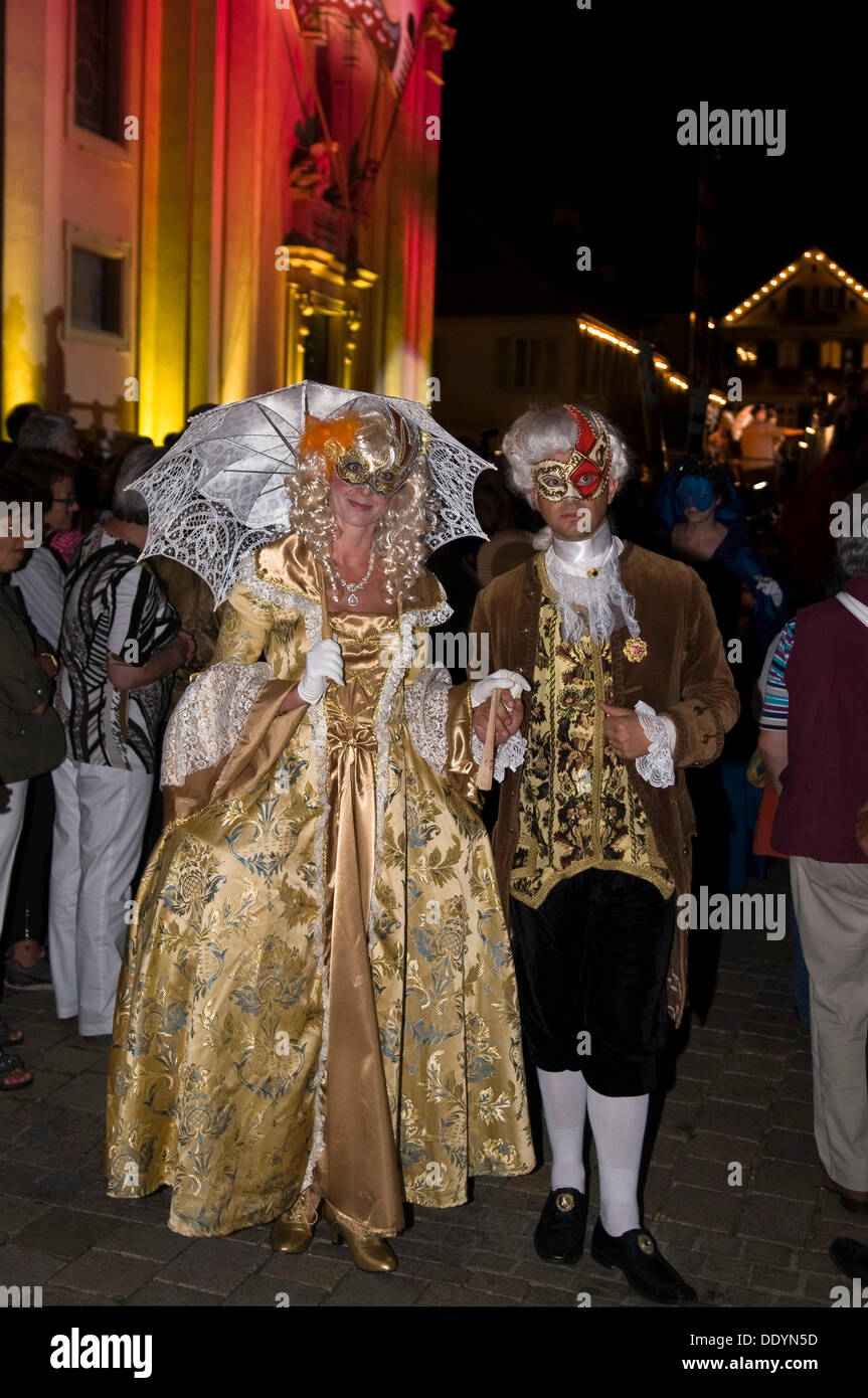 Parade of mask wearers in front of the historic municipal church ...