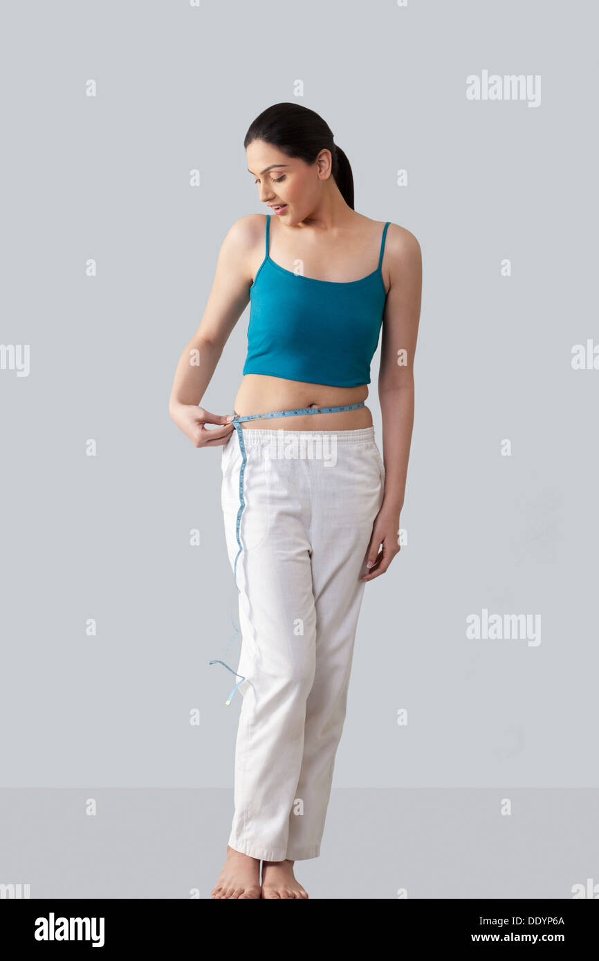 Indian woman measuring waist hi-res stock photography and images - Alamy