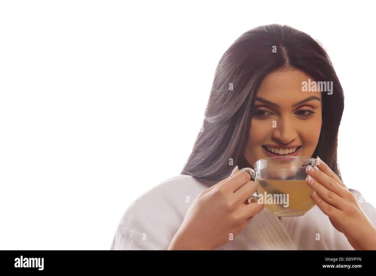 Happy thoughtful young woman holding tea cup Stock Photo - Alamy Happy thoughtful young woman holding tea cup Stock Photo - Alamy