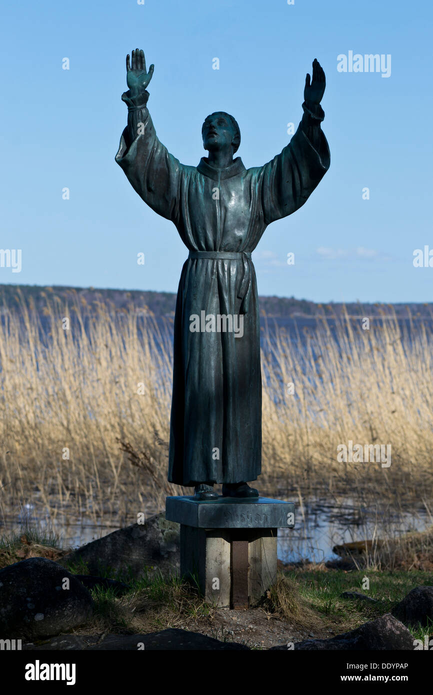 statue of a priest, raising his hands to the sky Stock Photo - Alamy