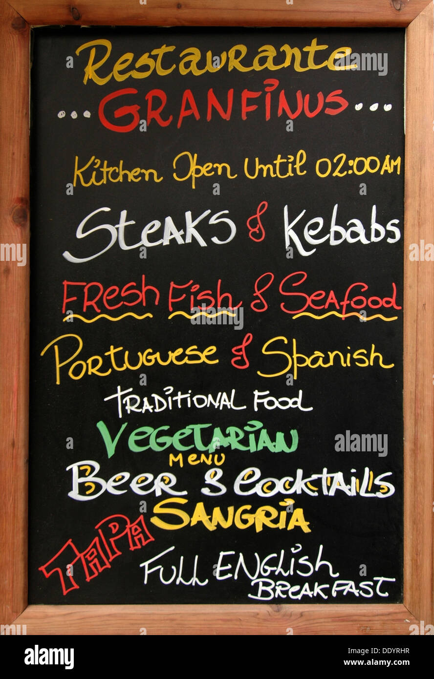 Restaurant menu board showing different dishes available in English in ...