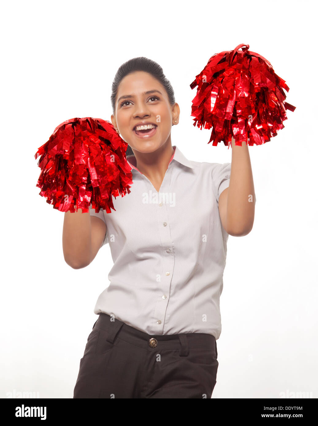 Happy cheer leader with pompoms screaming against white background ...
