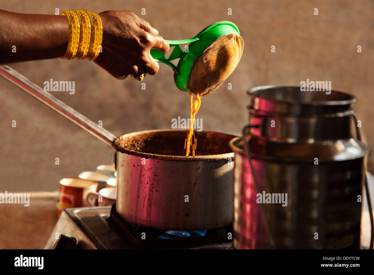 Female hand holding strainer while preparing chai Stock Photo - Alamy