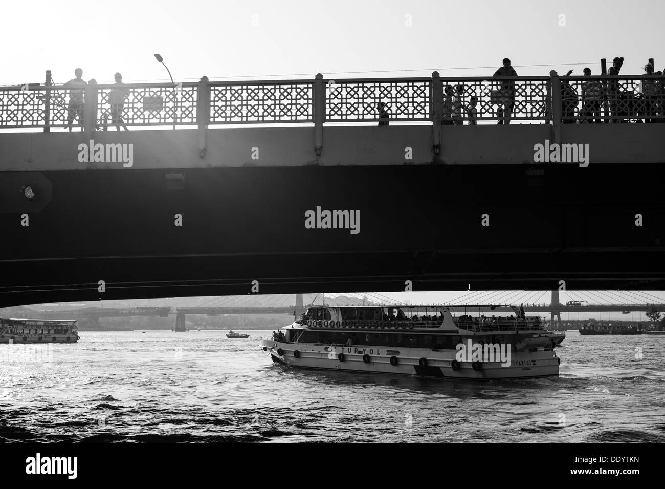 Cruise ferry under a bridge on the Bosphorus River in Istanbul Turkey ...