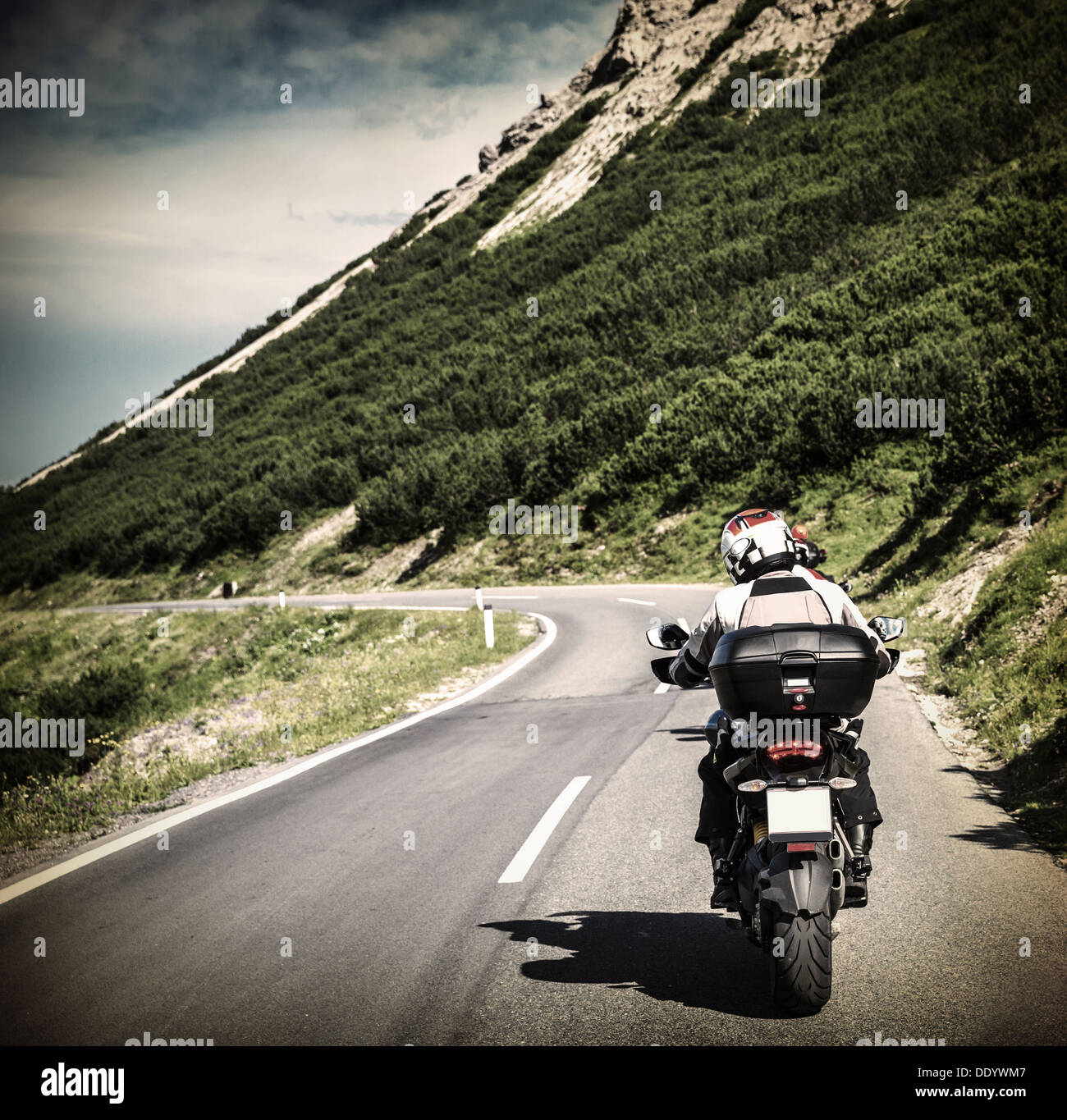 Motorcyclist riding on scenic highway hi-res stock photography and ...