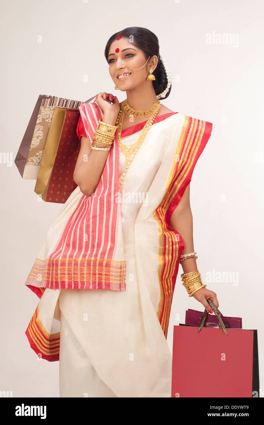 Bengali woman carrying shopping bags hi-res stock photography and ...