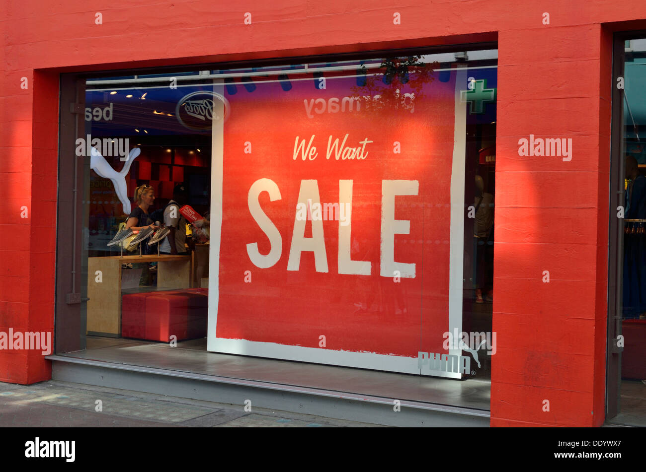 Red 'we want sale' sign in a shop window, London, UK Stock Photo - Alamy
