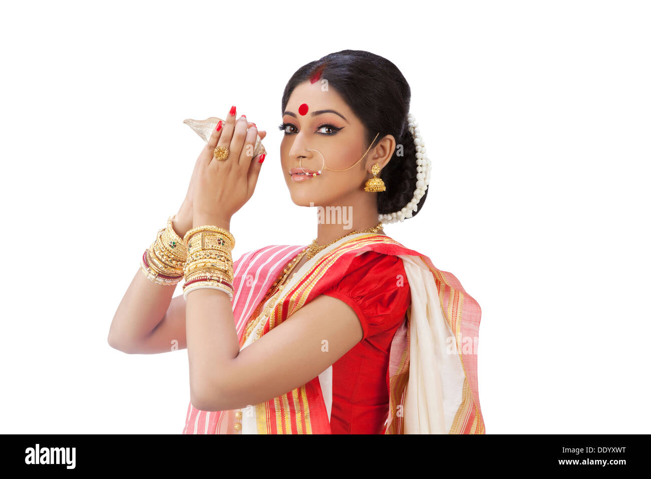 Portrait of Bengali woman holding a conch shell Stock Photo - Alamy
