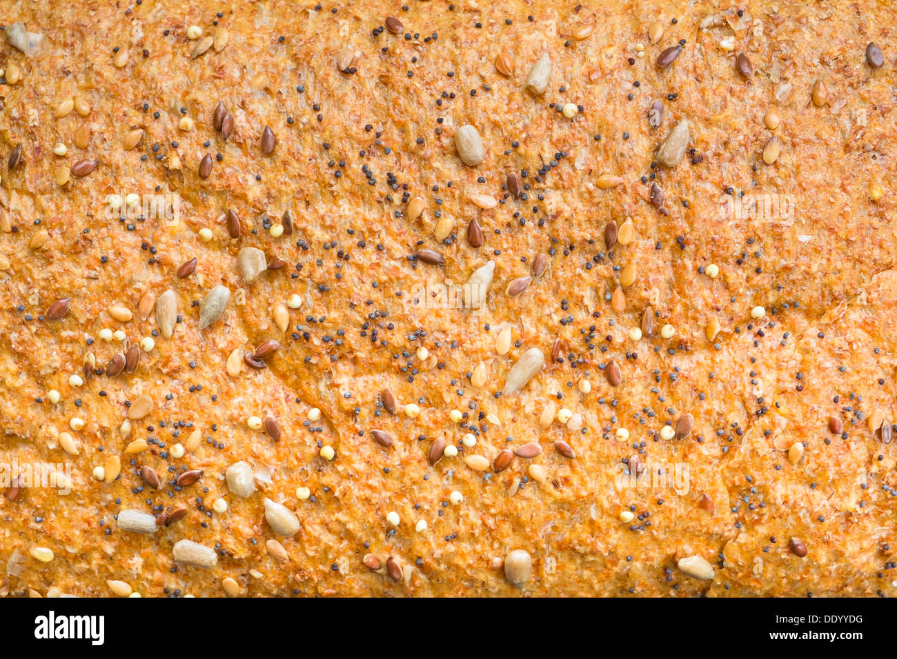 Background texture of a seeded loaf of wholemeal brown bread Stock ...