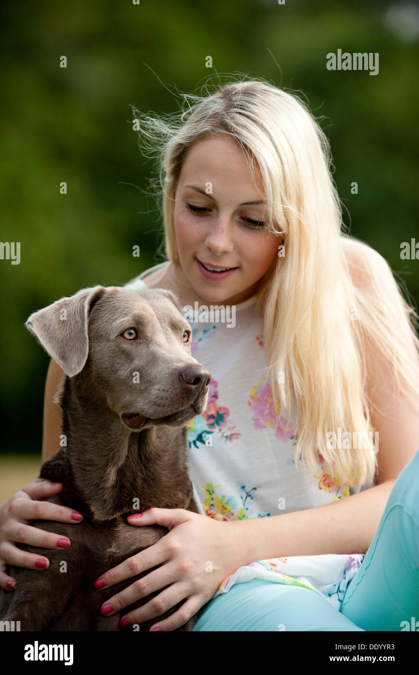 Woman with a Labrador Retriever Stock Photo - Alamy