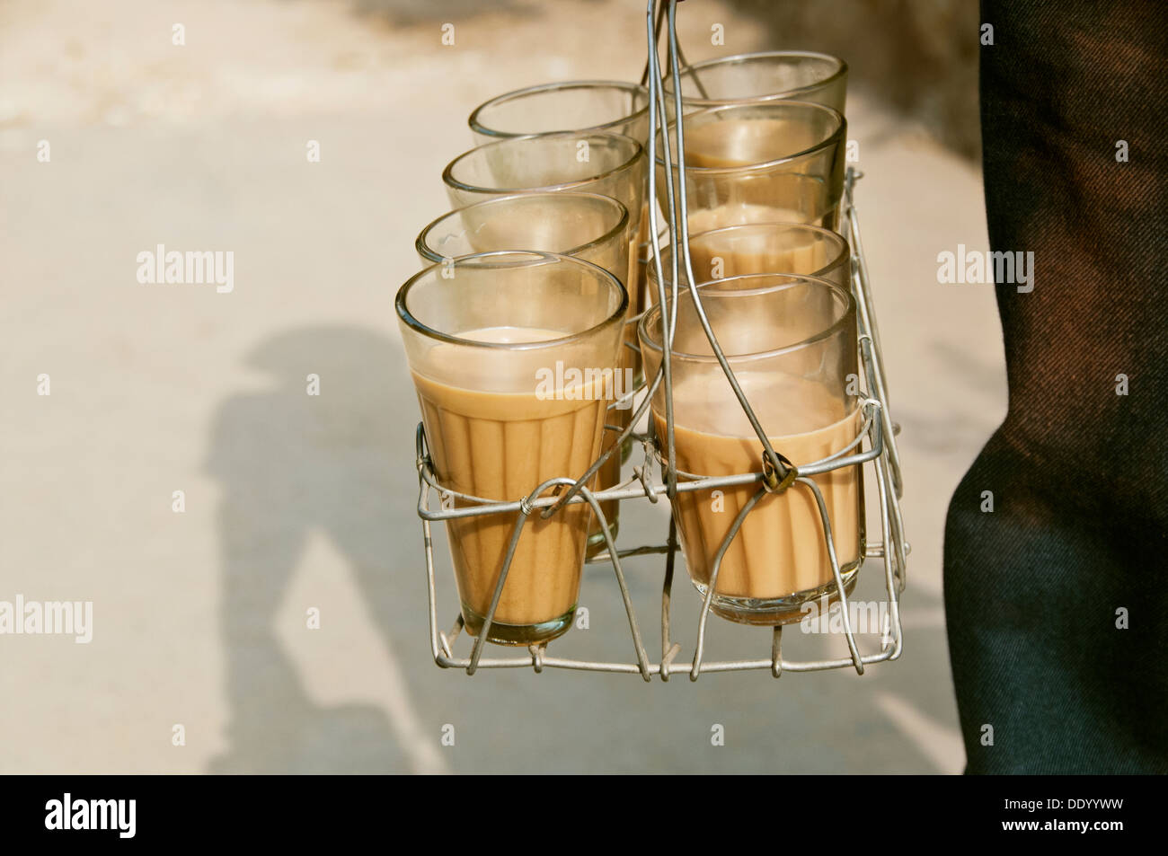 Glasses of chai in metal grid tray Stock Photo - Alamy