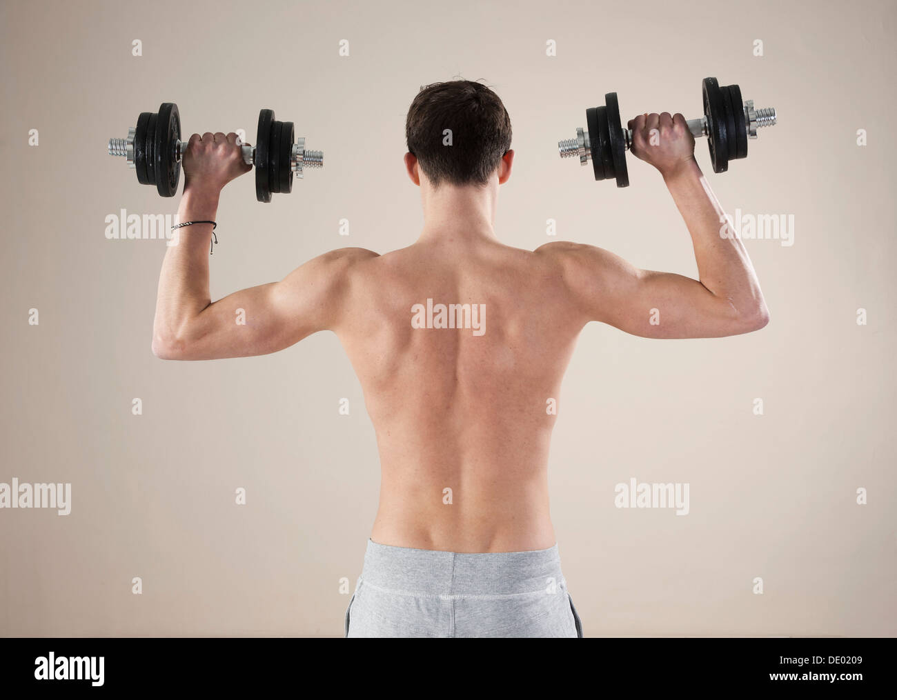 Man back muscles weights hi-res stock photography and images - Alamy