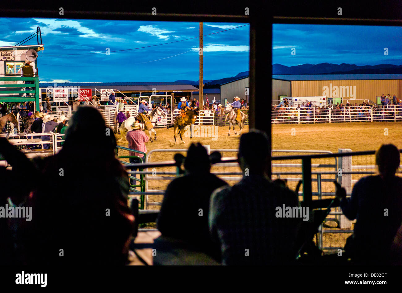 Spectators at dusk watch Chaffee County Fair & Rodeo, Poncha Springs ...