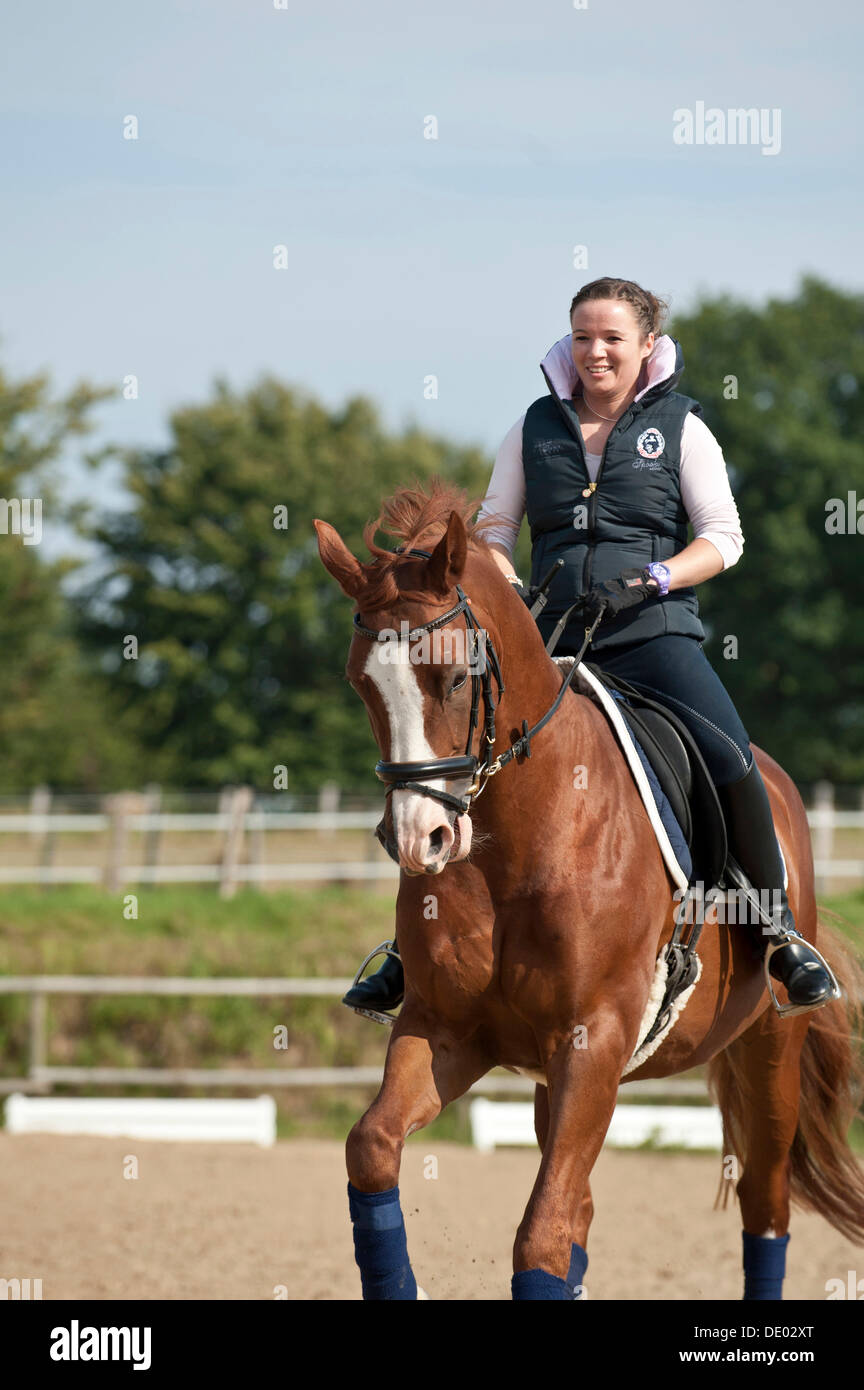 Woman riding a jumping horse hi-res stock photography and images - Alamy