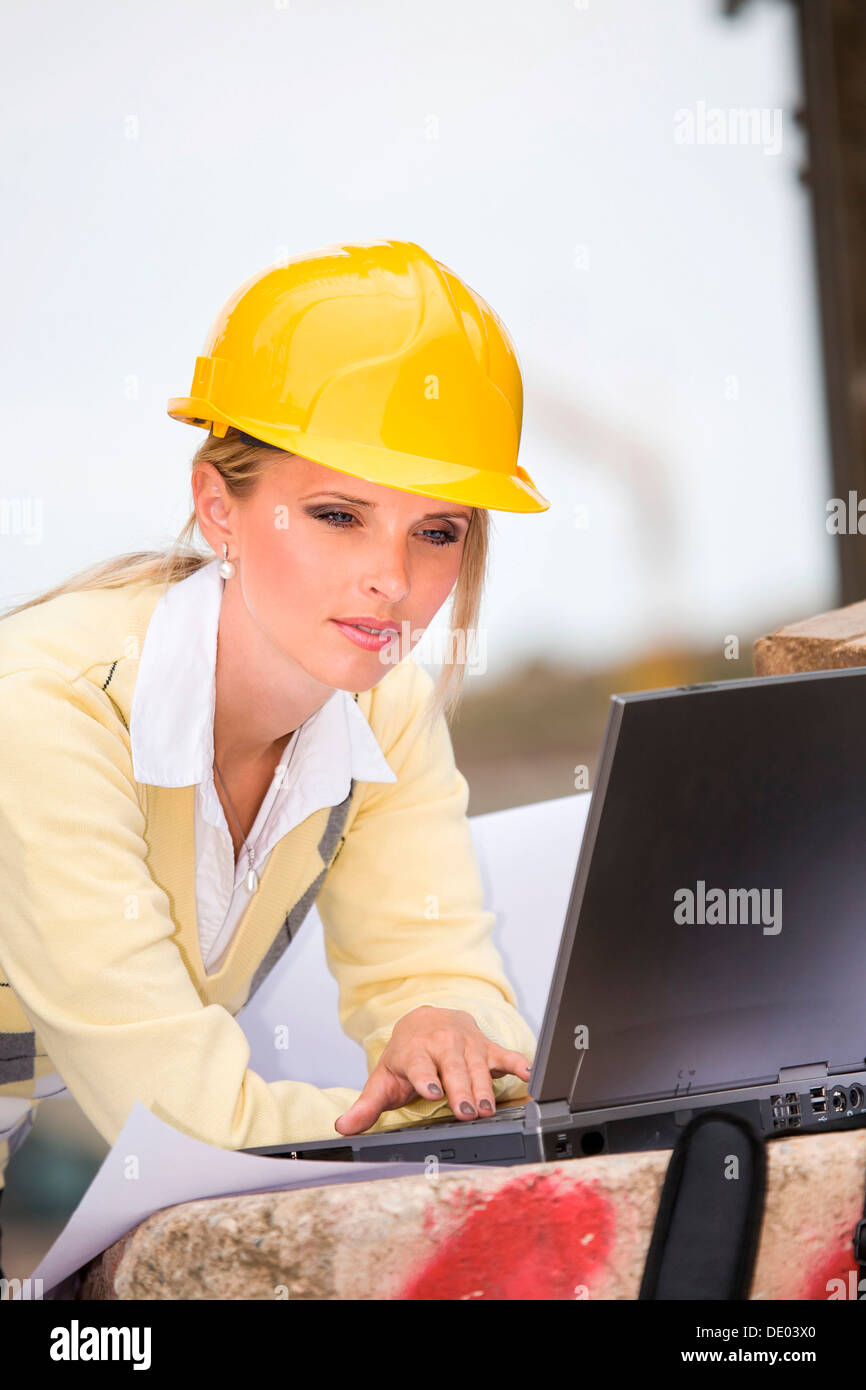 Young female constructor at building site Stock Photo - Alamy