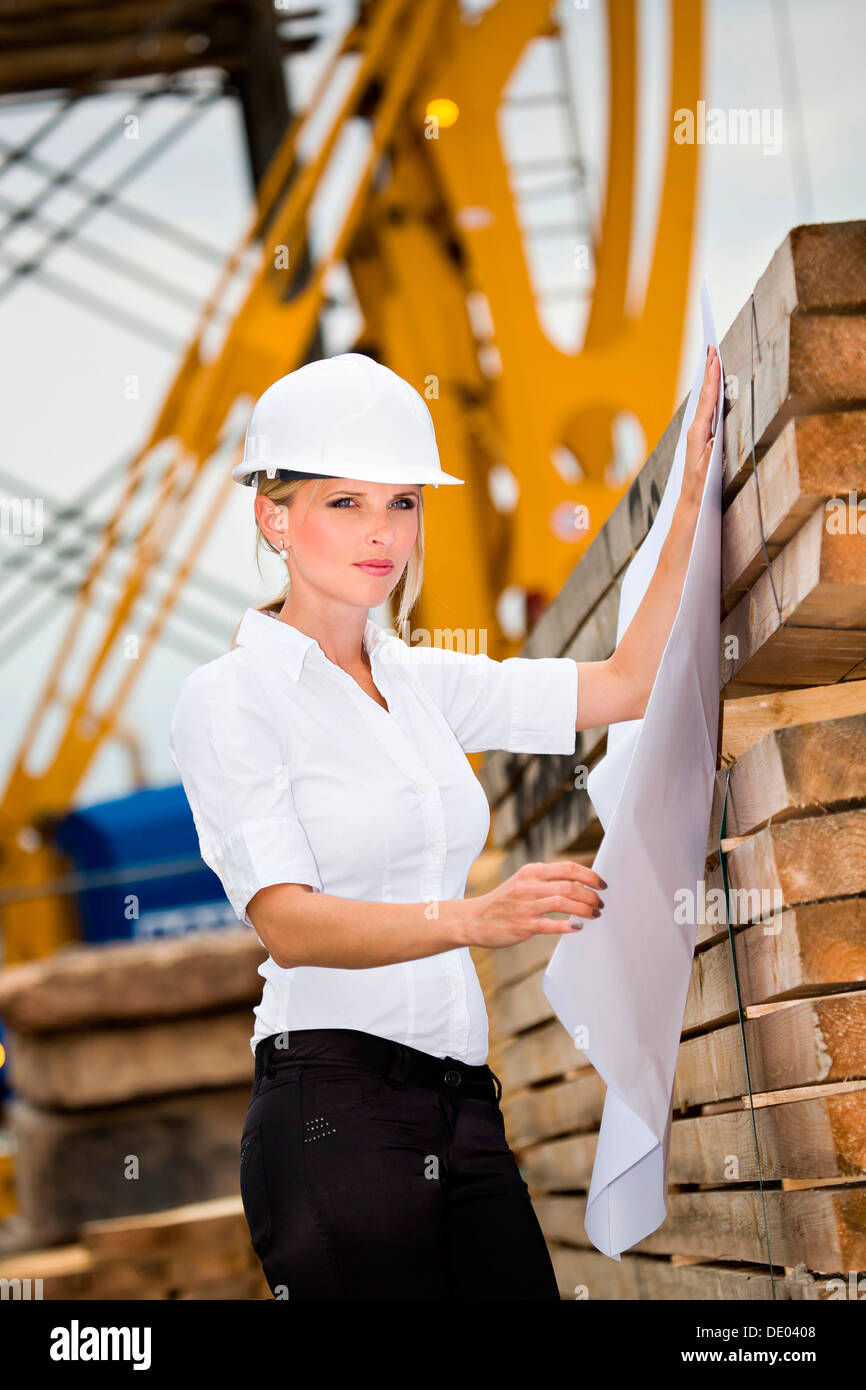 Young female constructor at building site Stock Photo - Alamy