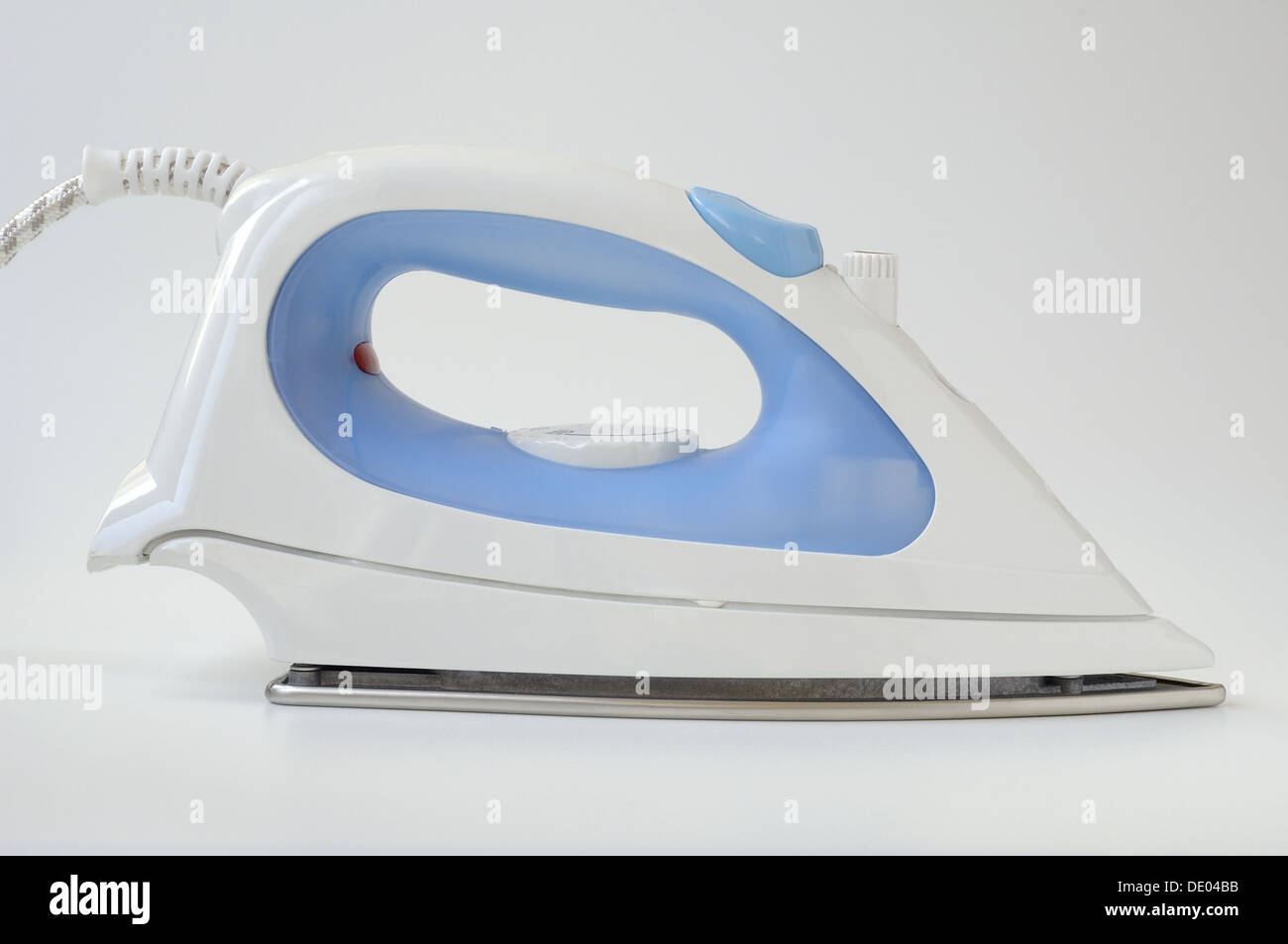 Hand held electric iron Stock Photo - Alamy