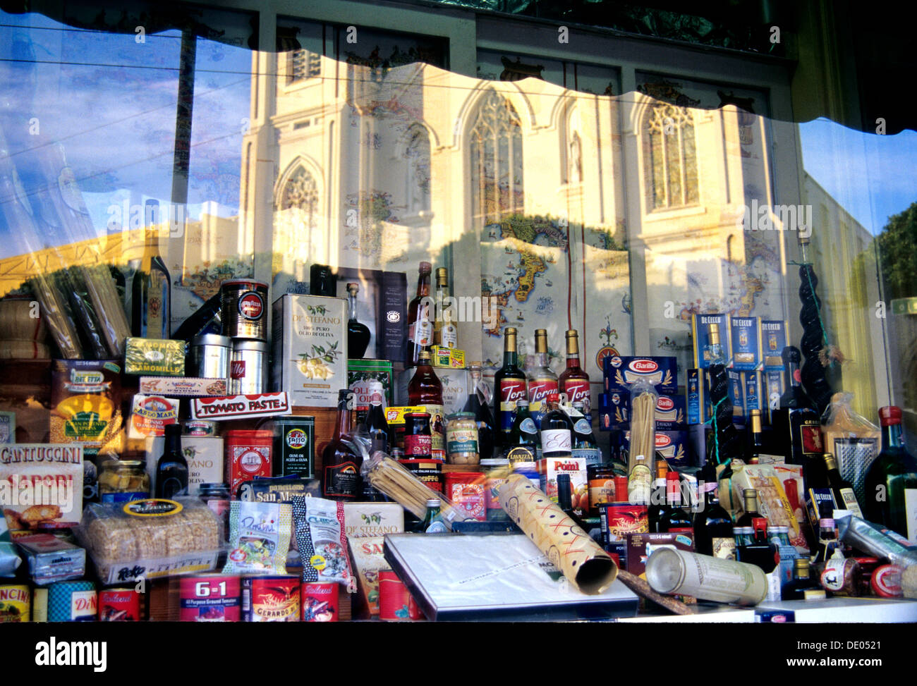 window reflection of St. Assisi church in Italian deli in North Beach ...