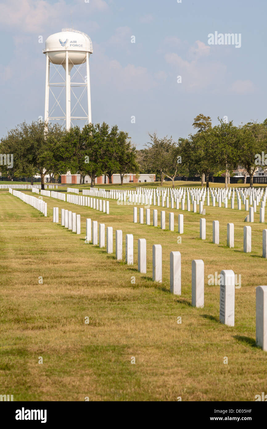 Grave marker headstones under a US Air Force water tower in the Biloxi ...