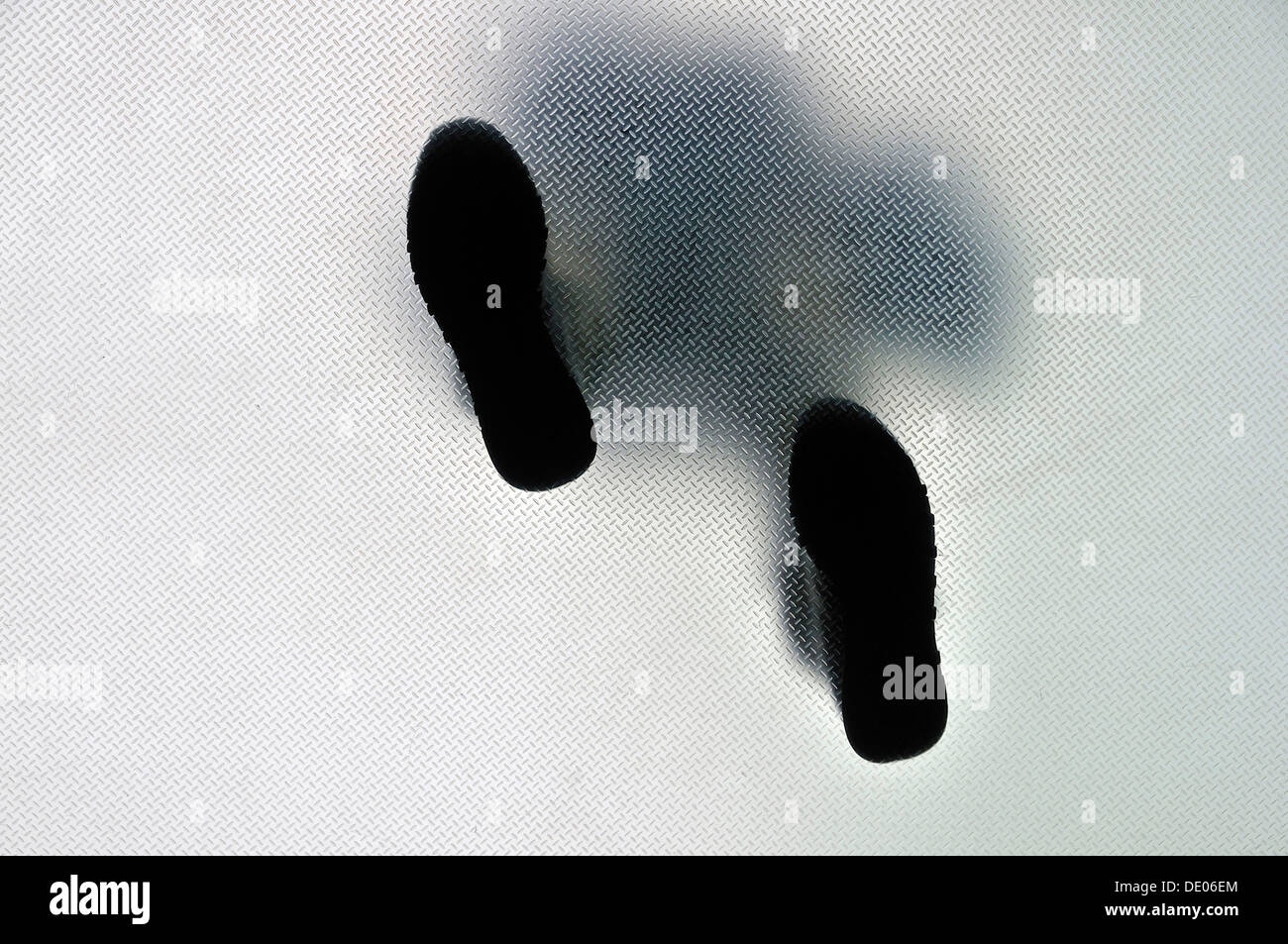 Anonymous walking person from below Stock Photo - Alamy