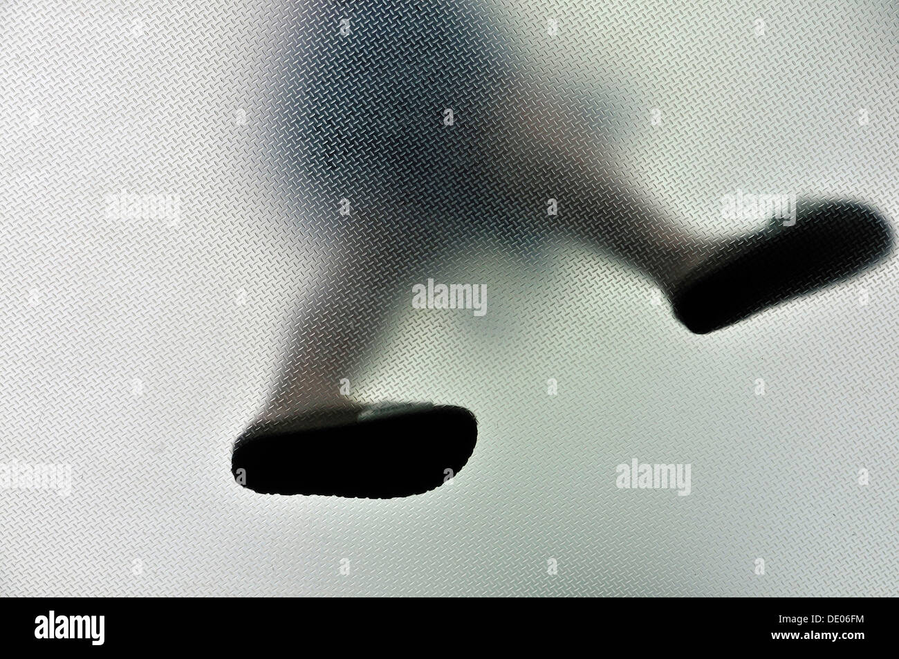 Anonymous walking person from below Stock Photo - Alamy