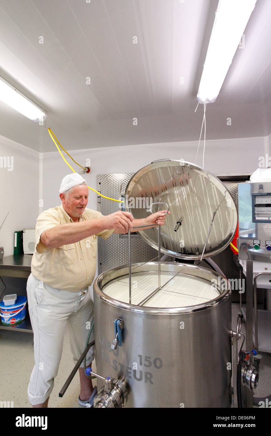 Cheesemaker during the production of goat cheese at the Goas-Alm cheese ...