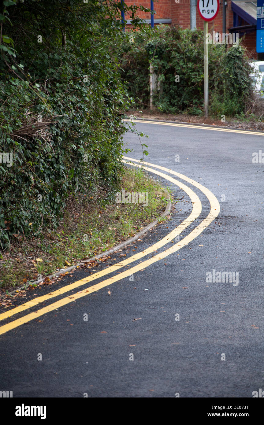 Double yellow lines Stock Photo - Alamy