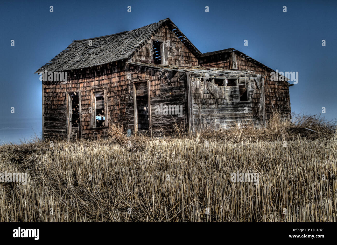 HDR photo of abandoned, old weathered, rustic rural house with porch ...