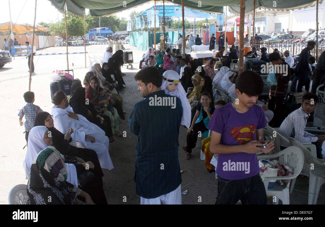 Pakistani pilgrims are waiting at Jinnah International Airport Hajj ...