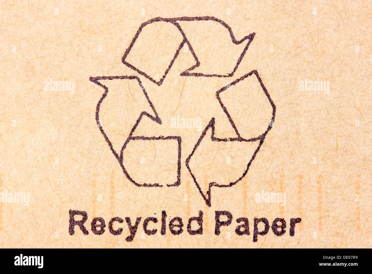 Brown recycled paper with black recycle symbol Stock Photo - Alamy