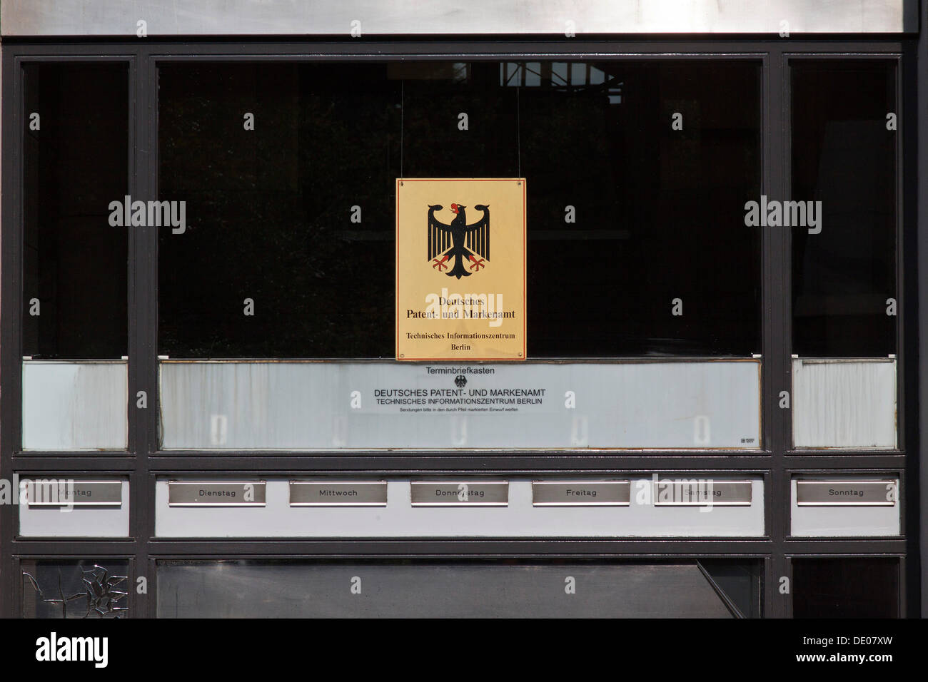 Sign, dirty window, lettering "Deutsches Patent- und Markenamt", German ...