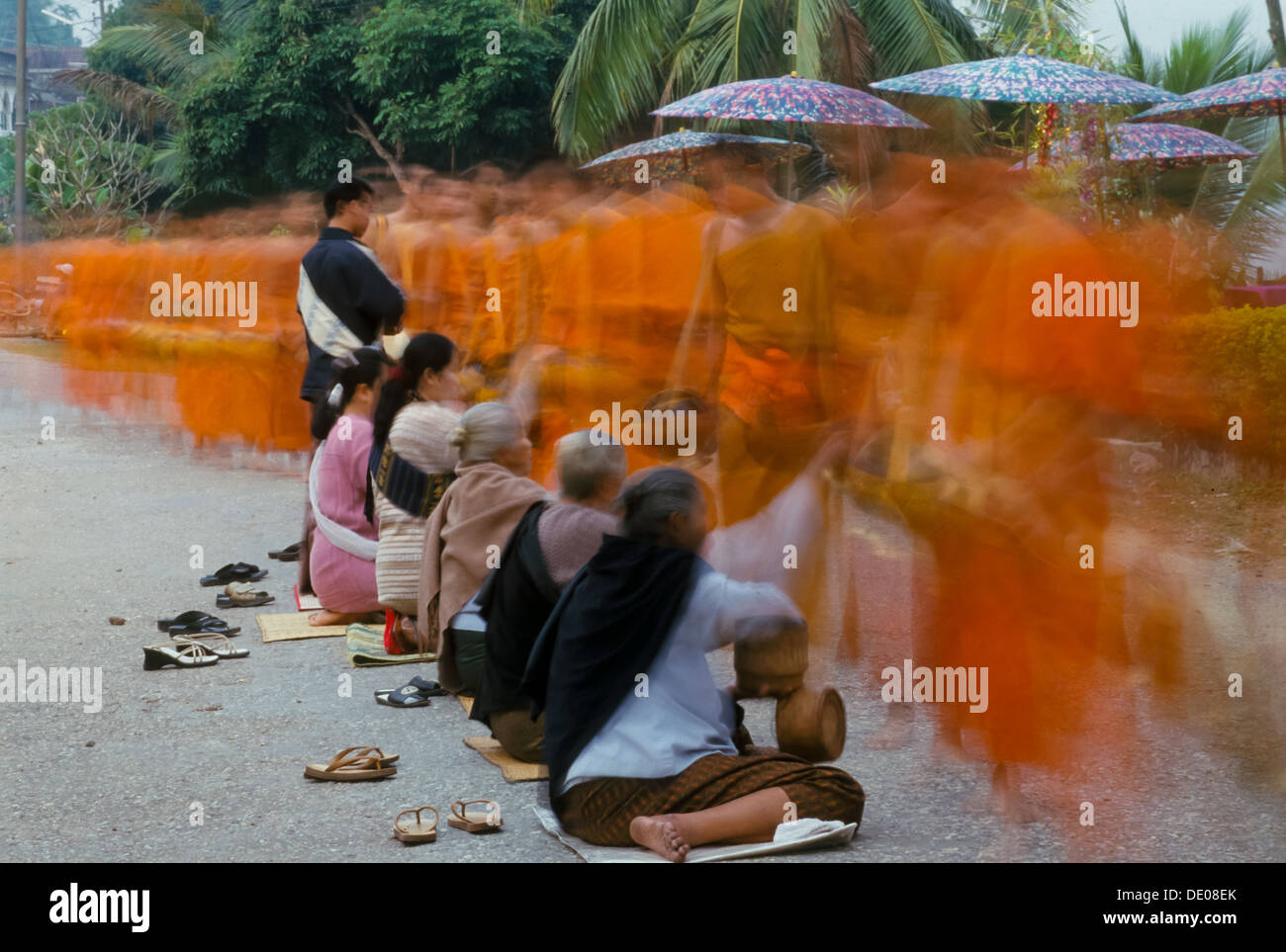 Buddhist monks on their morning alms round, Lao New Year, Luang Prabang ...