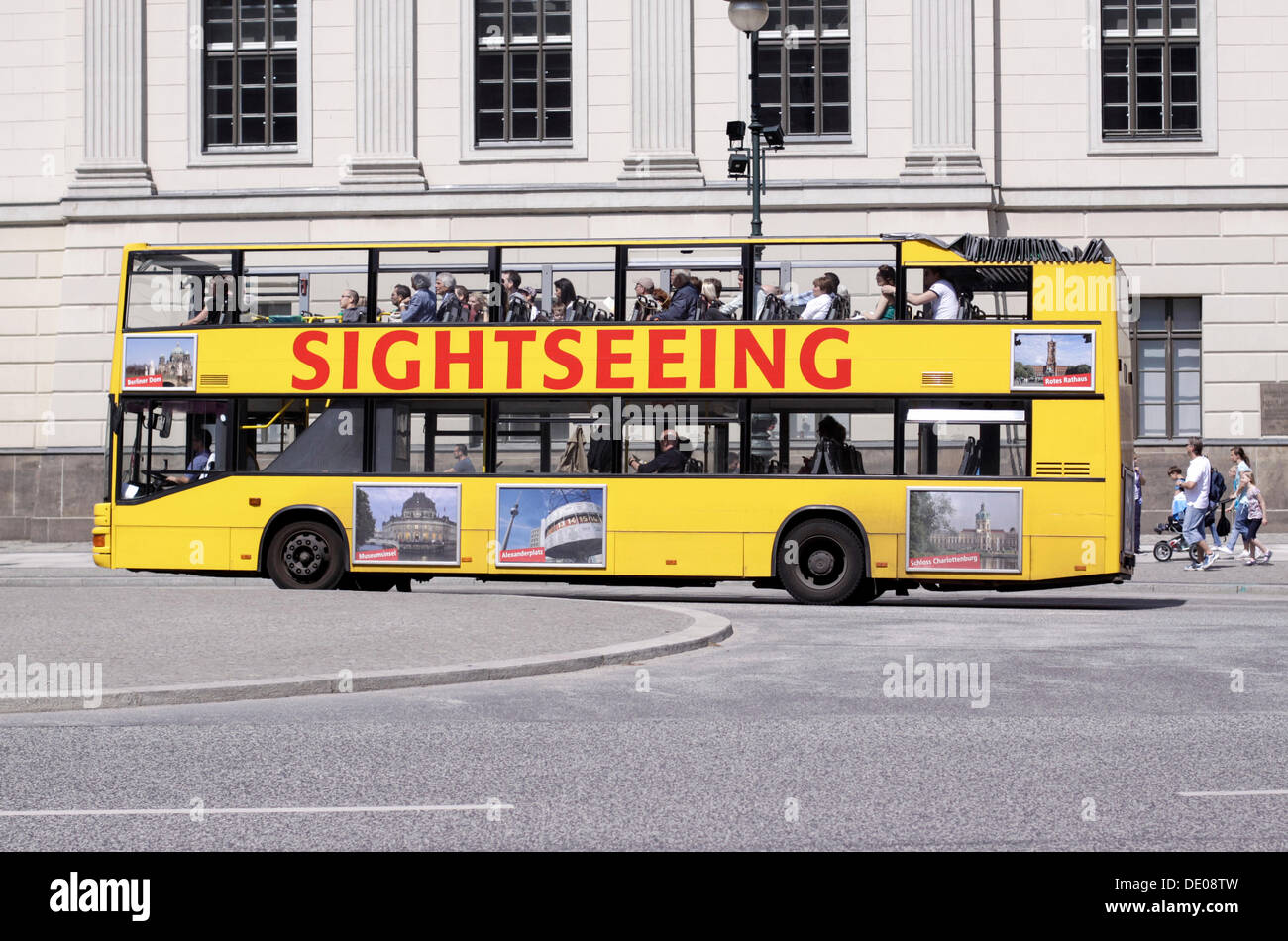 Sightseeing bus with tourists Stock Photo - Alamy