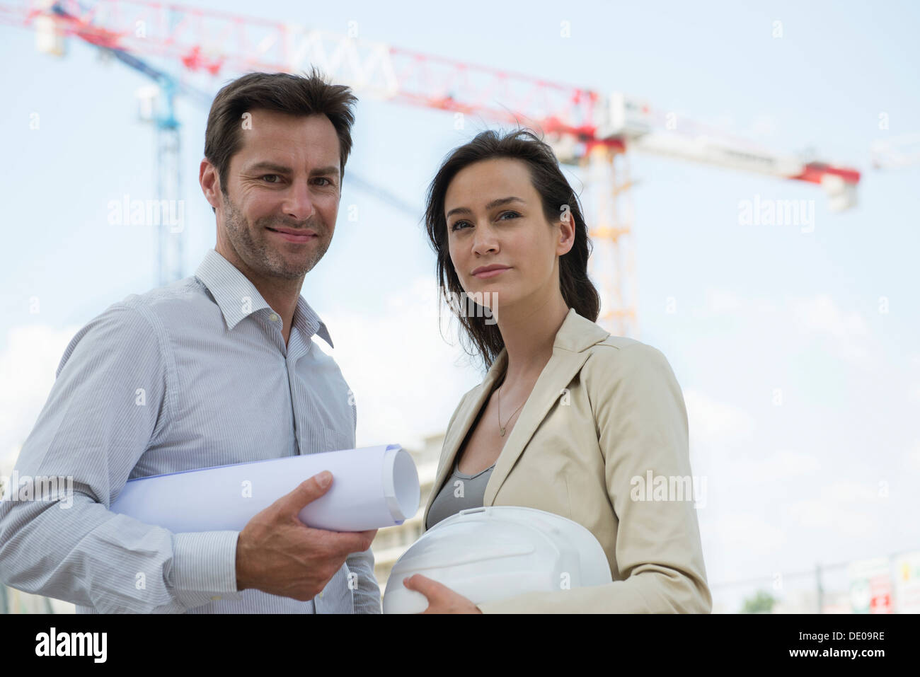 Architects in construction site, portrait Stock Photo - Alamy