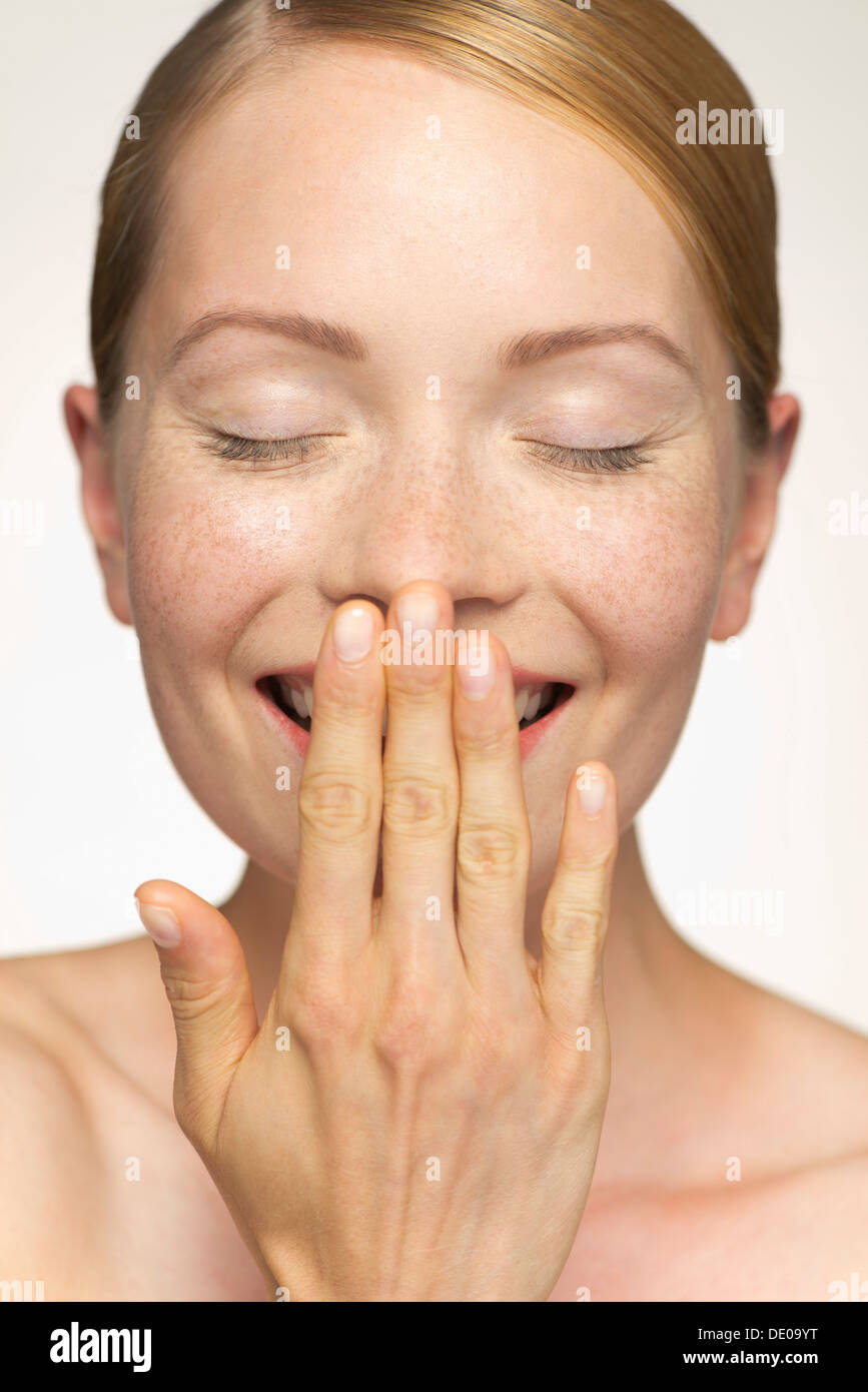 Hands over mouth hi-res stock photography and images - Alamy