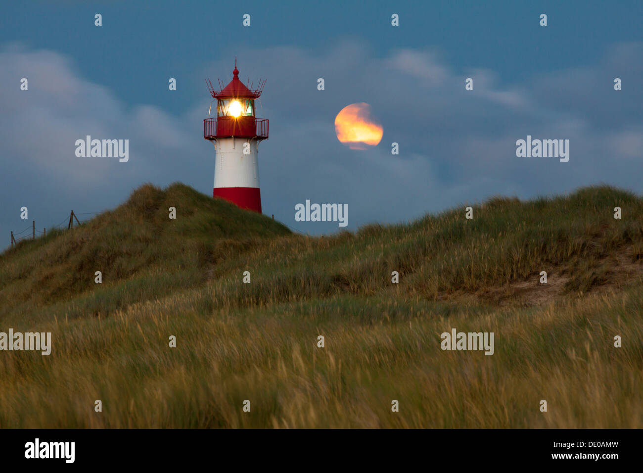 List Ost lighthouse at dusk with the full moon Stock Photo - Alamy