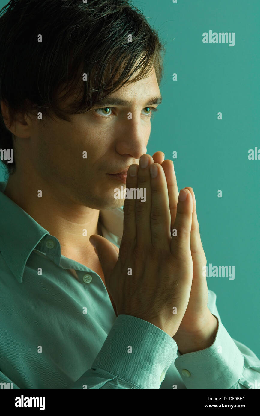 Latin american man praying eyes hi-res stock photography and images - Alamy