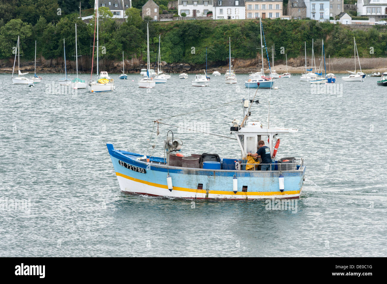A commercial fishing boat leaving the harbour at Douarnenez Brittany ...