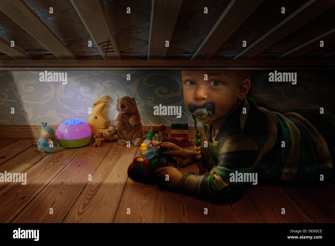 A young boy checking whether all monsters, ghosts and spirits have ...