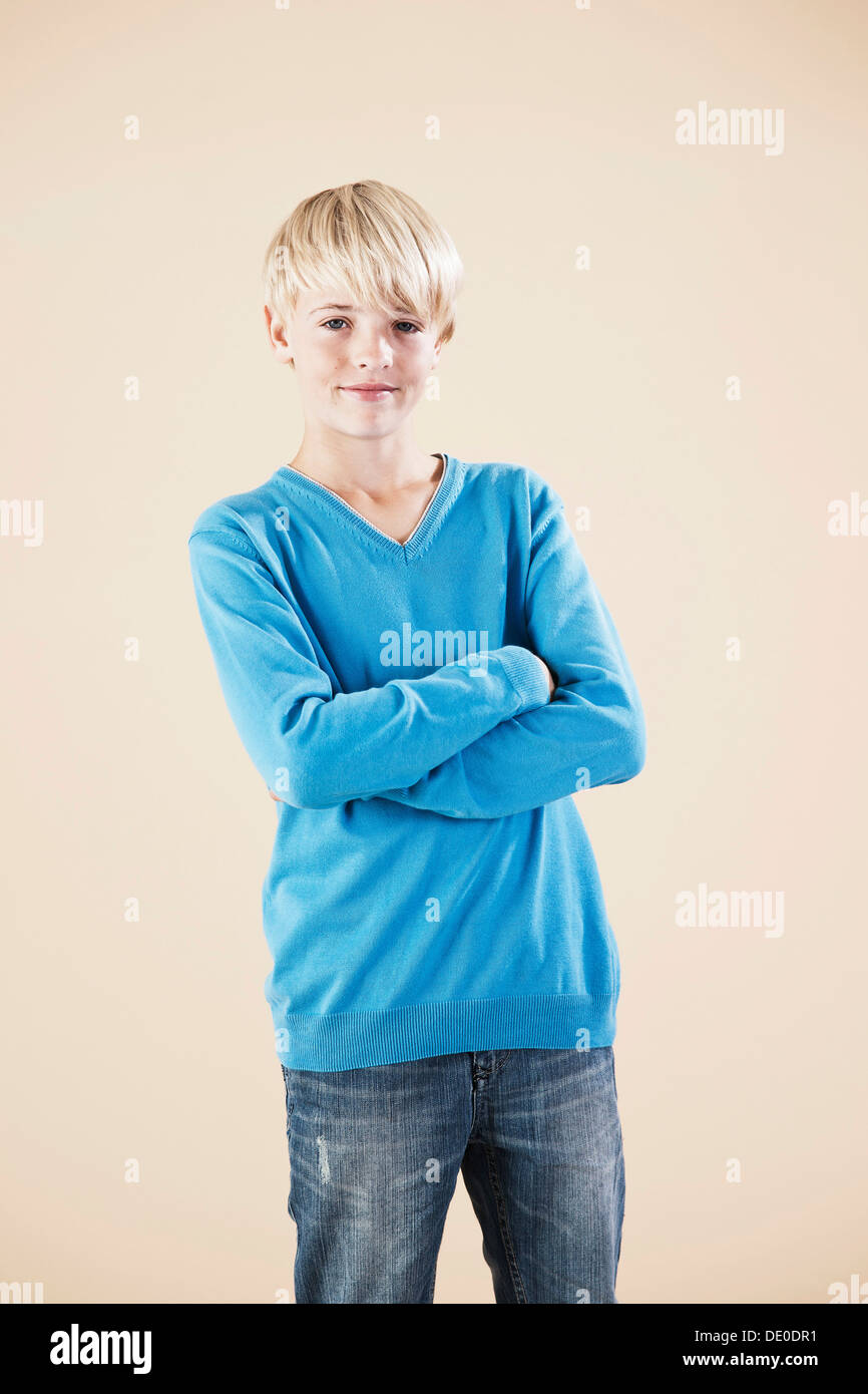 Boy in a blue sweater and jeans Stock Photo - Alamy