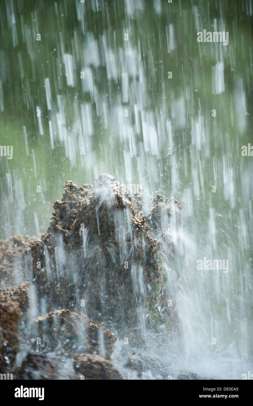 Water splashing on rocks Stock Photo - Alamy