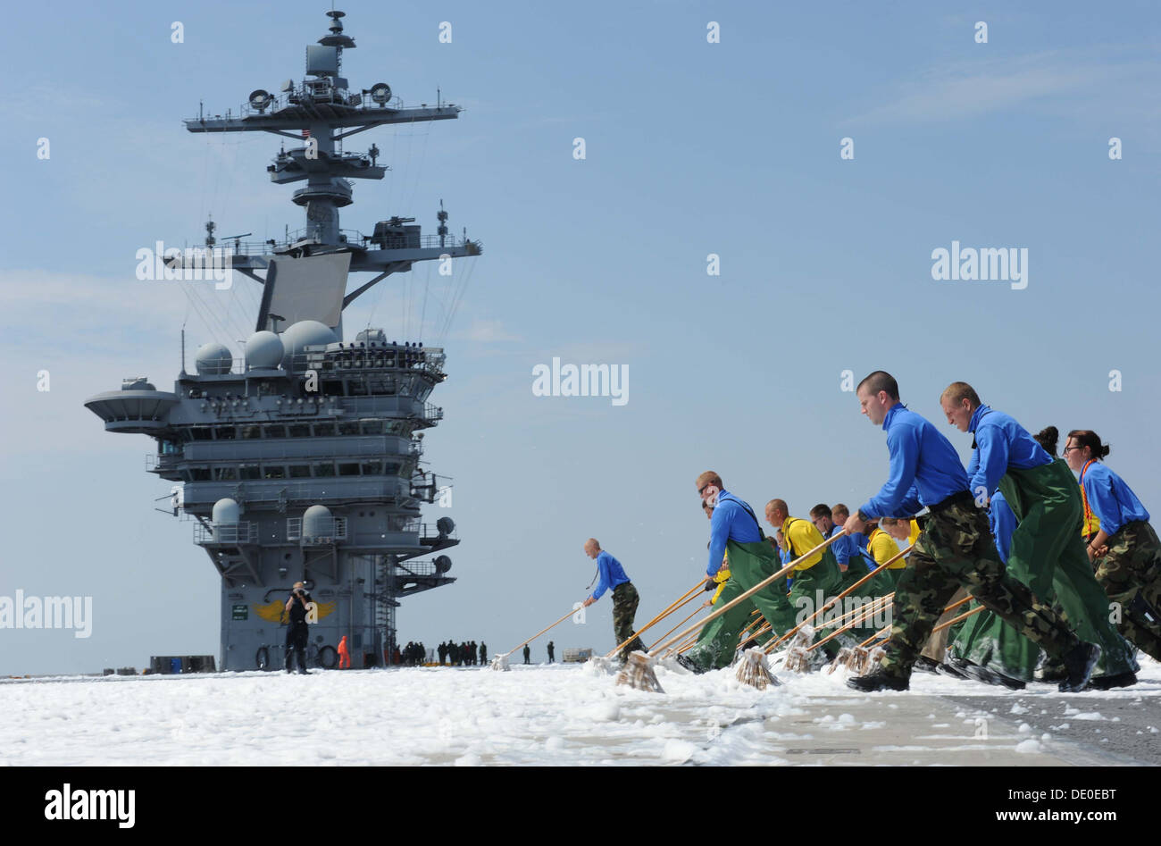 US Navy sailors aboard the aircraft carrier USS Theodore Roosevelt ...