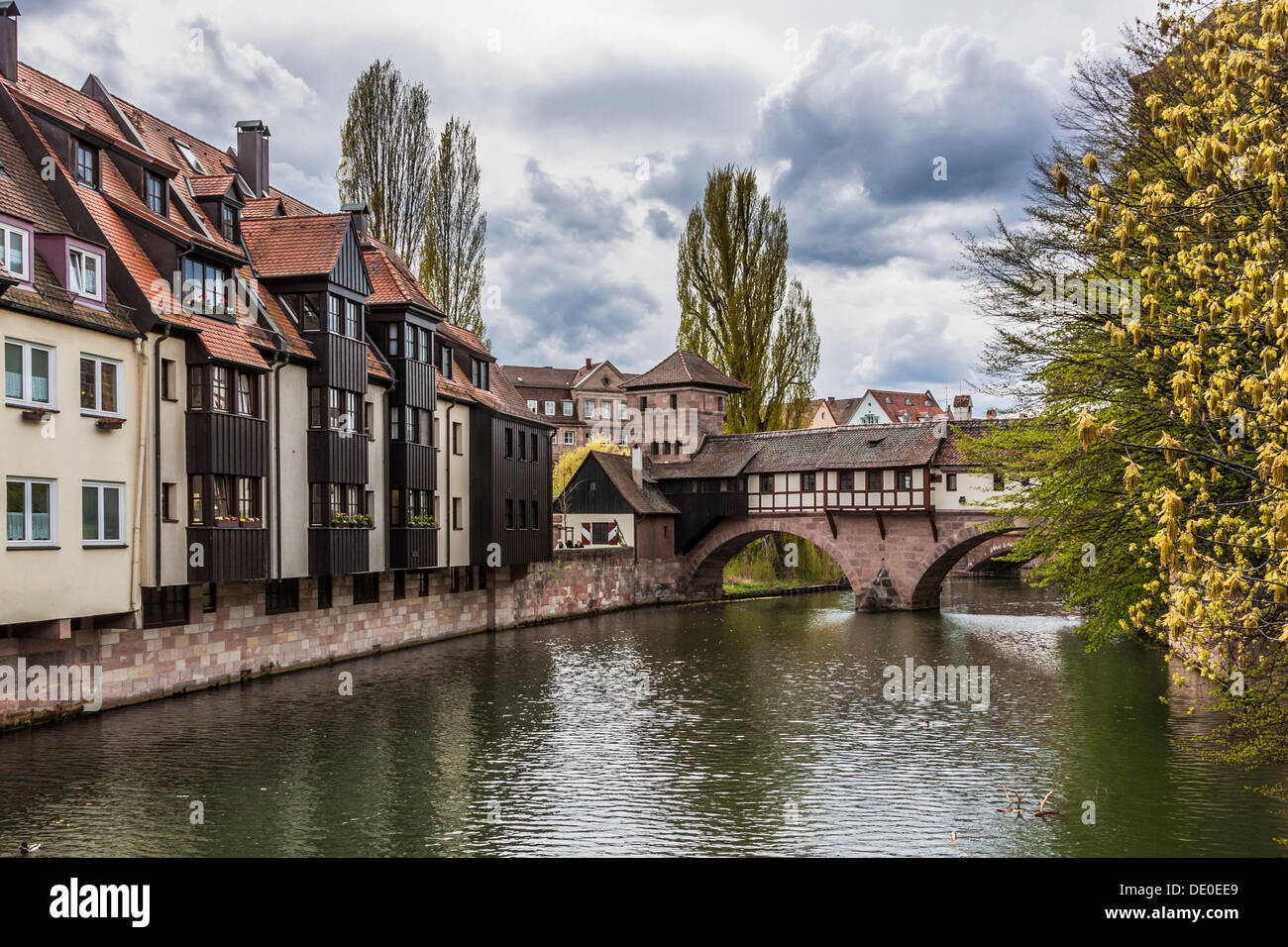 Pegnitz river with the Henkersteg footbridge and the Henkerhaus ...